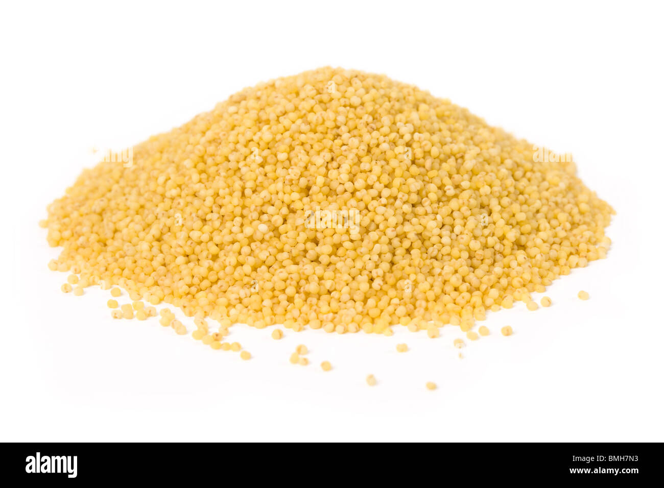 yellow millet seeds with white background Stock Photo - Alamy