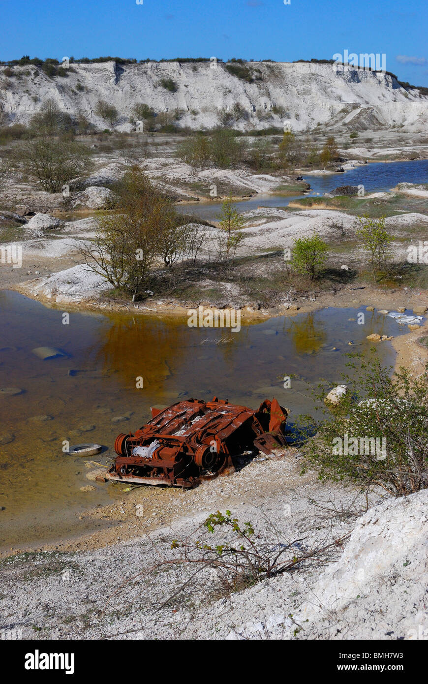 car dumped in Quarry Stock Photo - Alamy