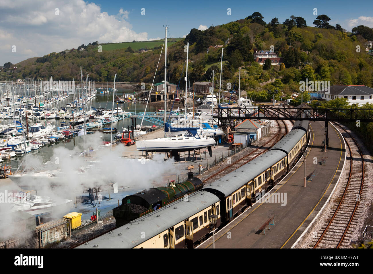 UK, England, Devon, Kingswear station platform, steam locomotive moving ...