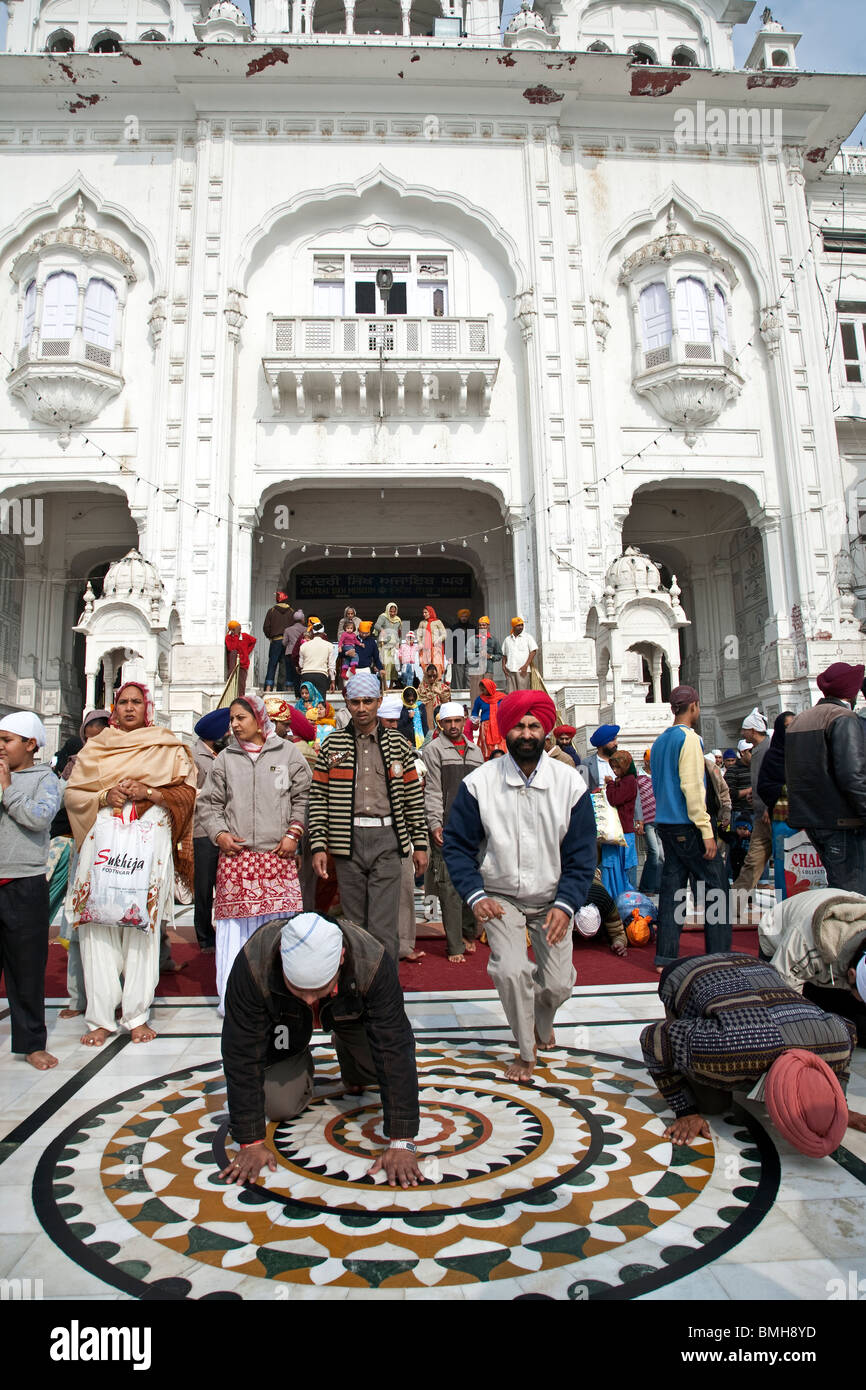 India People Praying Prostrating High Resolution Stock Photography and ...