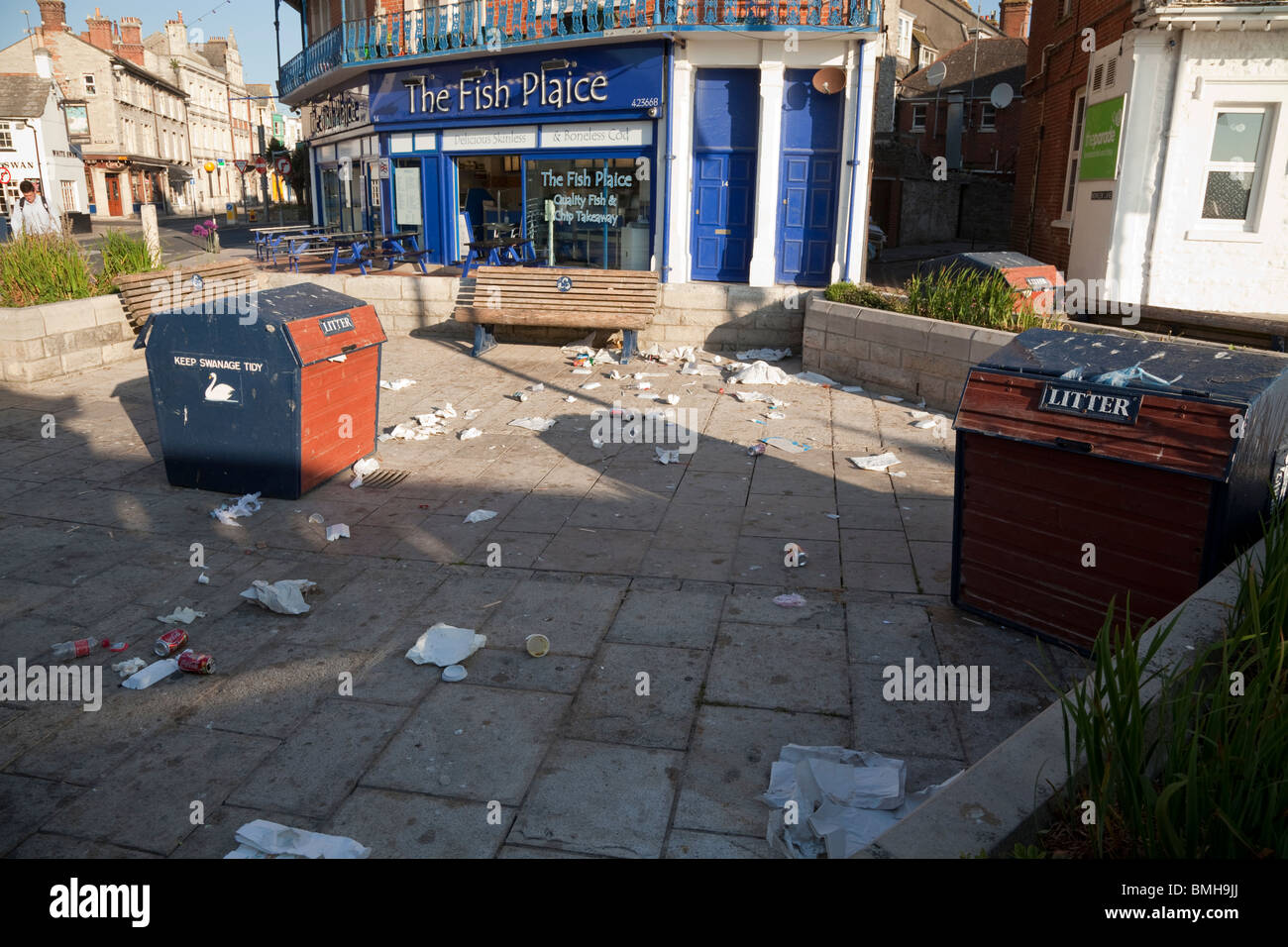 litter and rubbish left outside a seaside chip shop to be cleared up ...