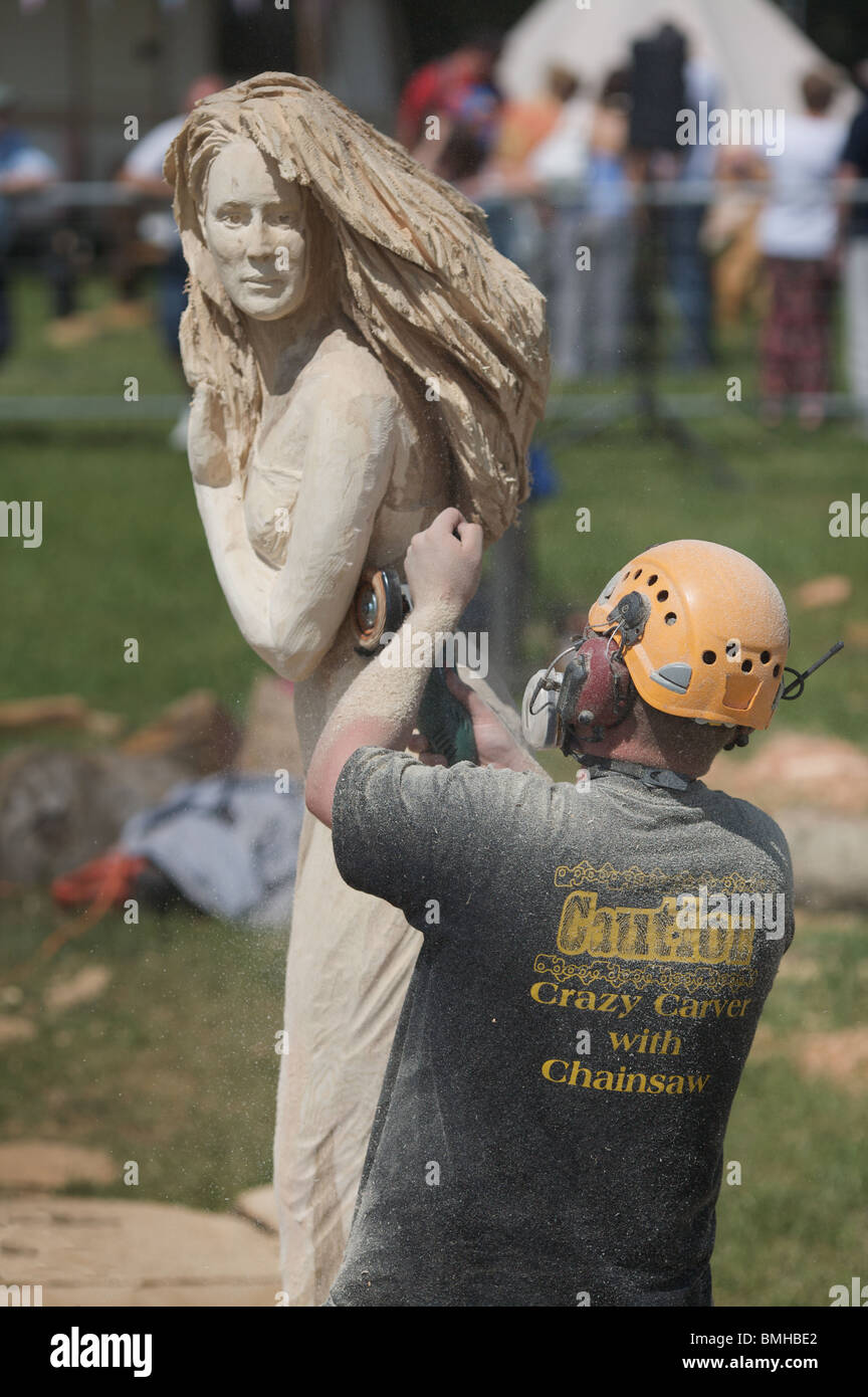 A competitor in the wood carving competition, Woodfest Wales, St Asaph ...