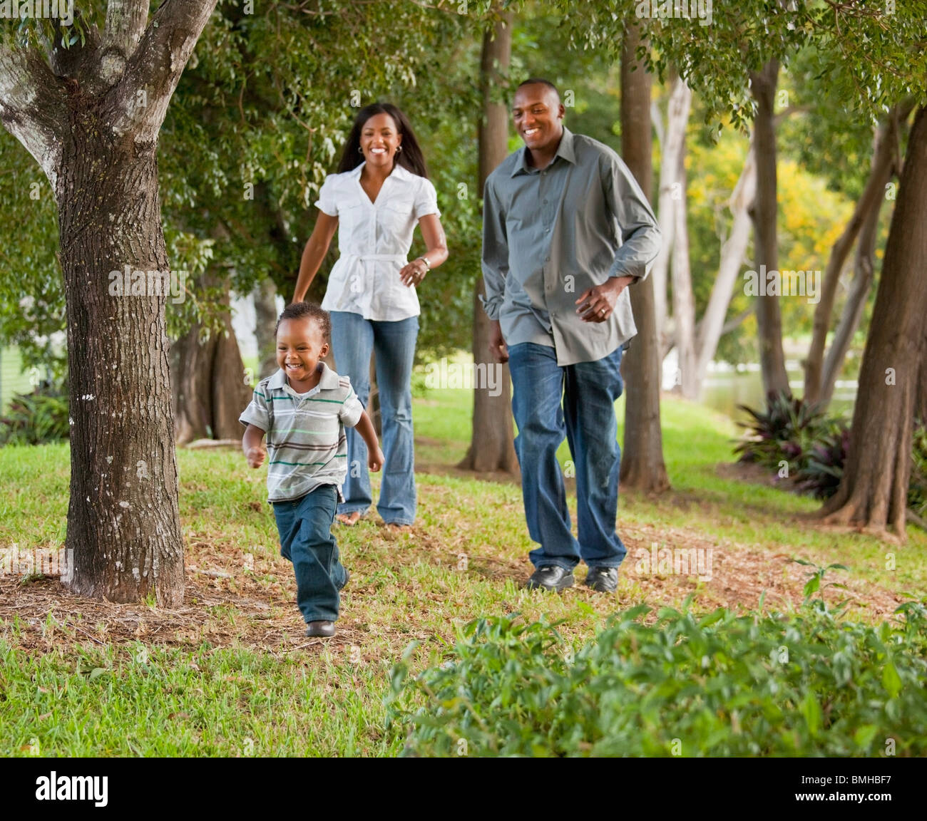 Parents chasing kid fun hi-res stock photography and images - Alamy