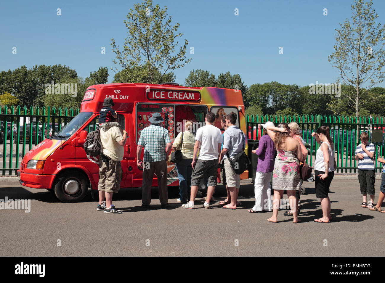 A line of people at an ice cream van at Twickenham Rugby Stadium, home ...
