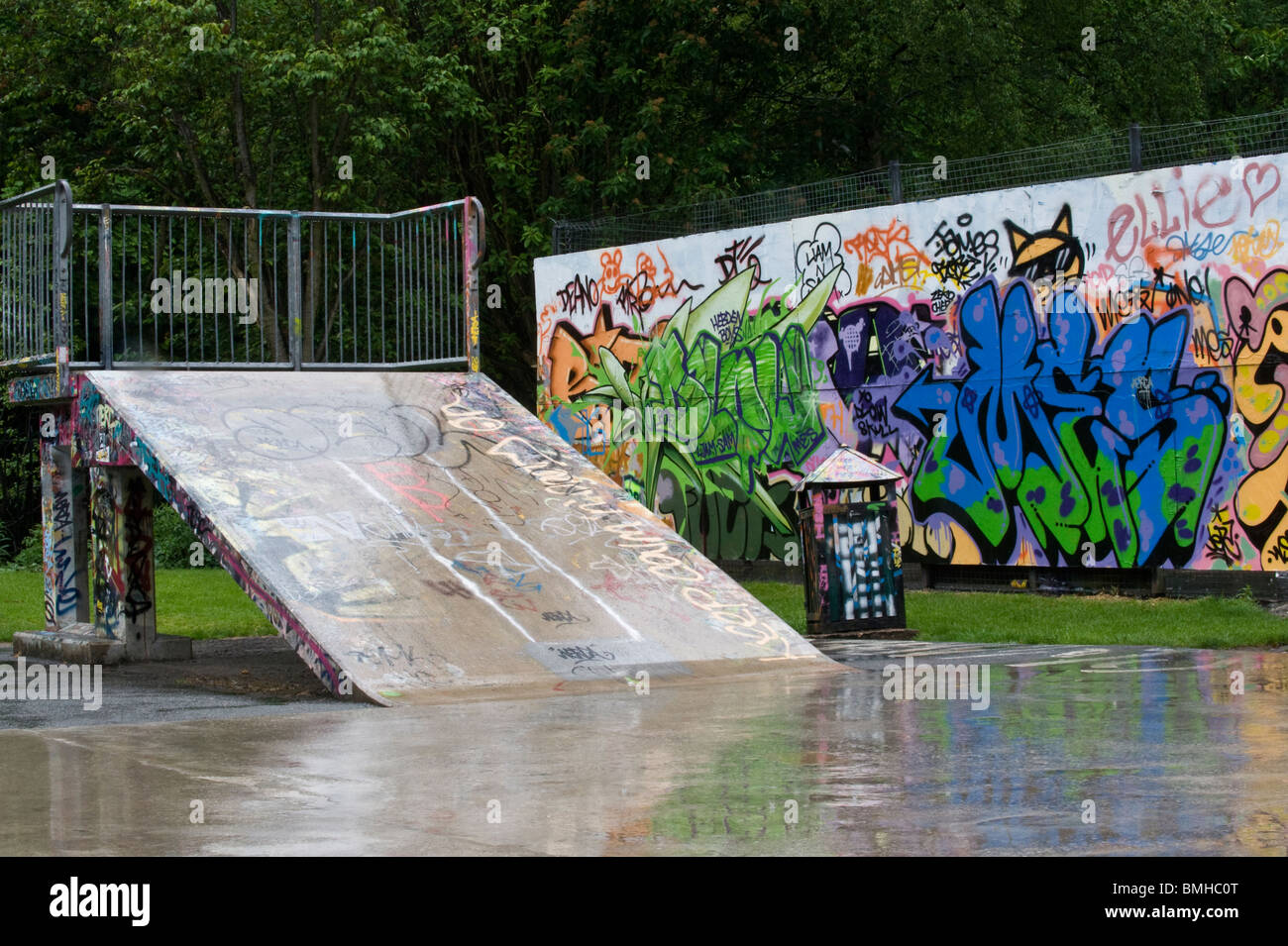 Playground with graffiti in rain Hebden Bridge West Yorkshire England ...