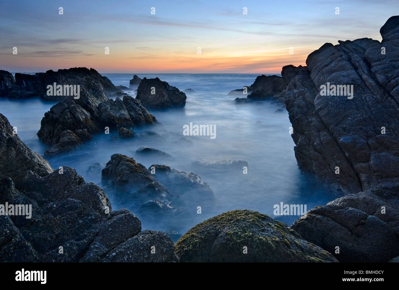 Rocky Asilomar Beach in Monterey Bay at sunset Stock Photo - Alamy