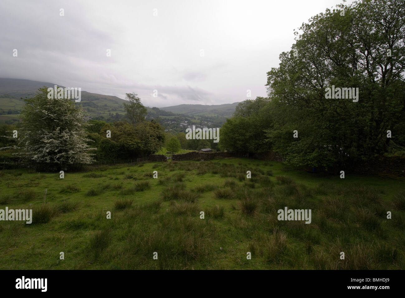 Loughrigg Fell and a view of the town of Ambleside, Lake District, UK ...