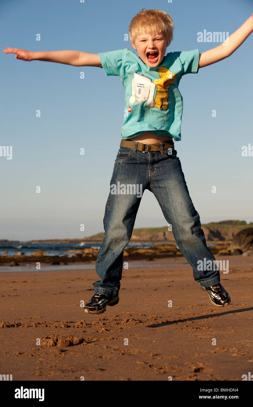 Jumping on a beach hi-res stock photography and images - Alamy