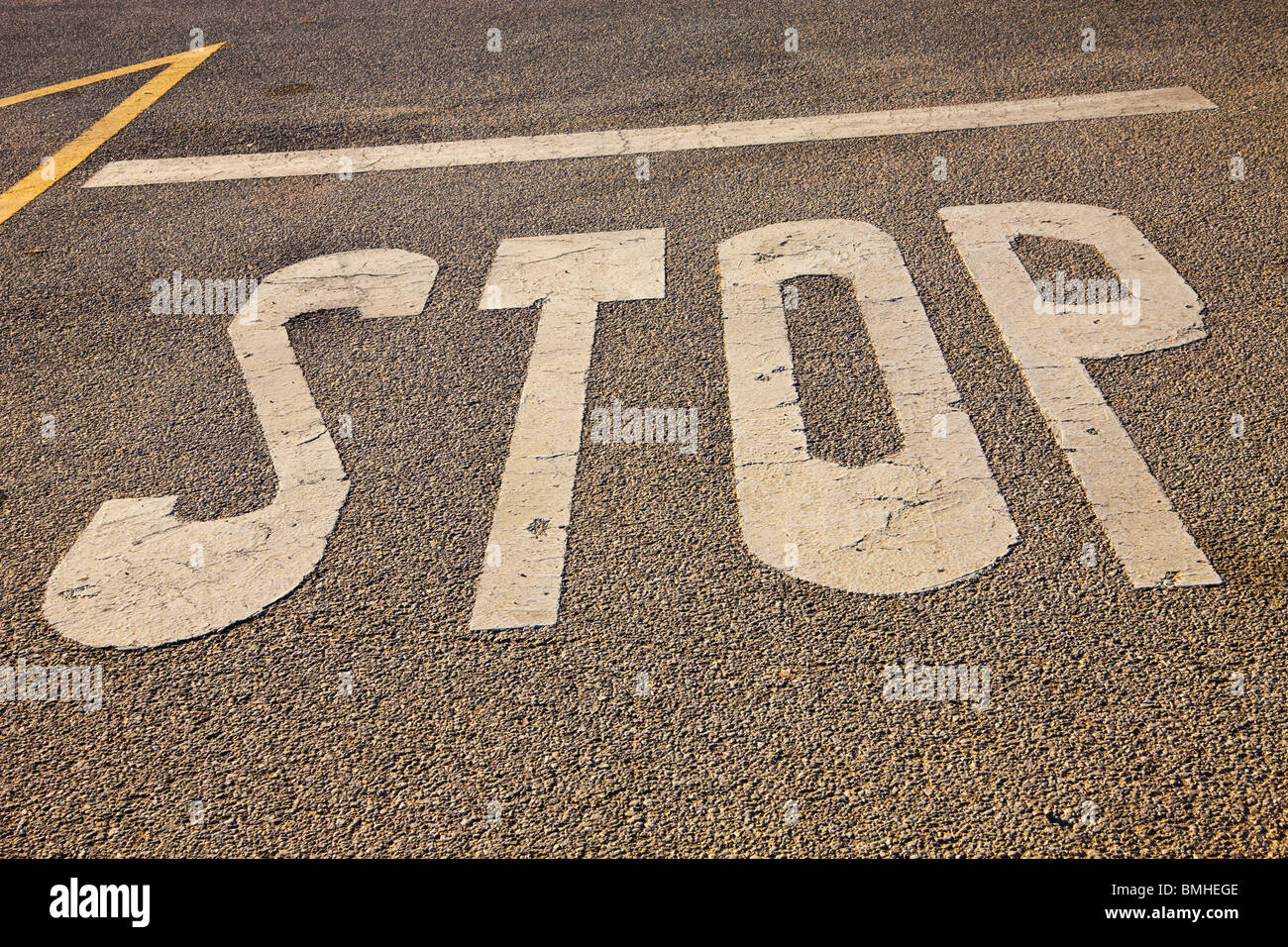 Stop Painted On Road Stock Photo - Alamy