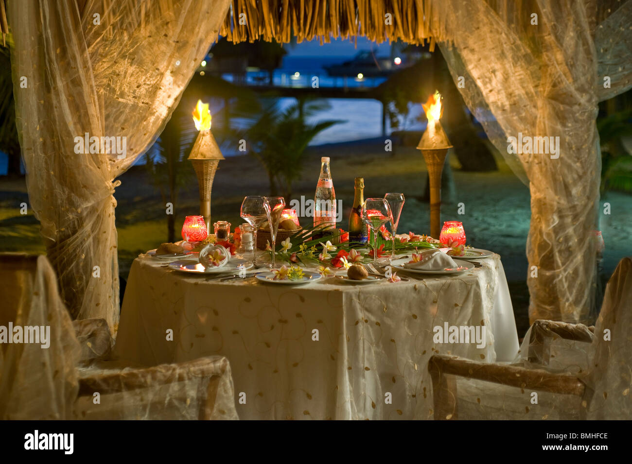 Romantic dinner in a polynesian resort Stock Photo - Alamy