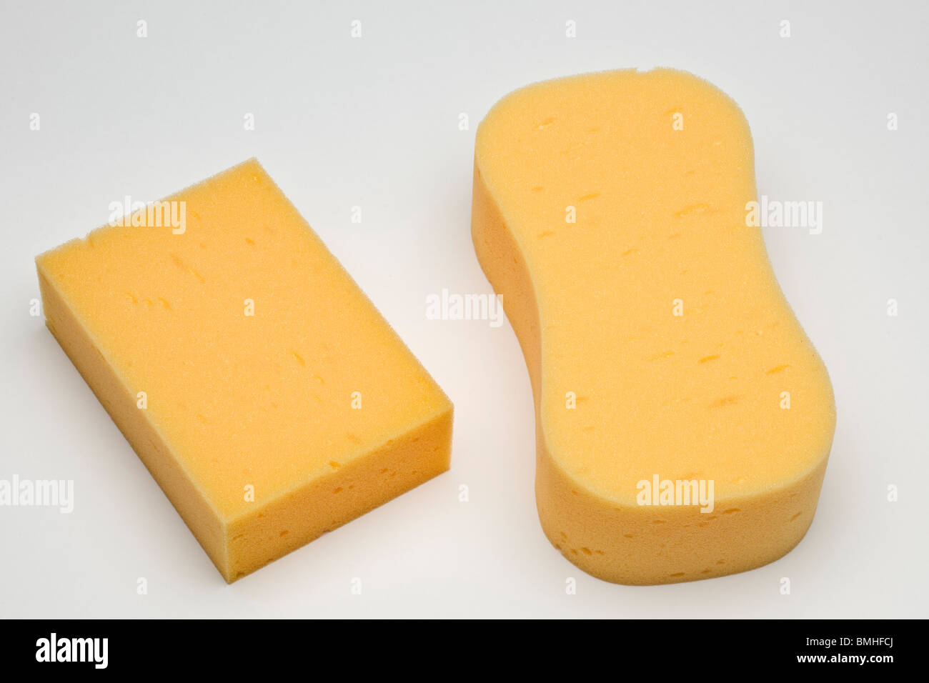 Two yellow sponges Stock Photo - Alamy