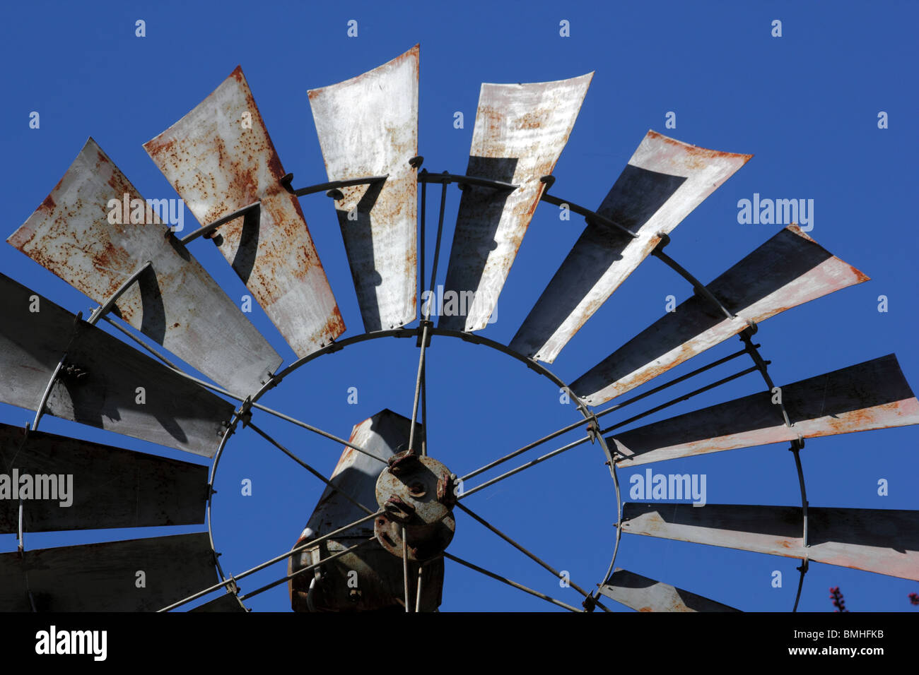 SILVER WINDMILL AGAINST BLUE SKY BACKGROUND BDB Stock Photo - Alamy