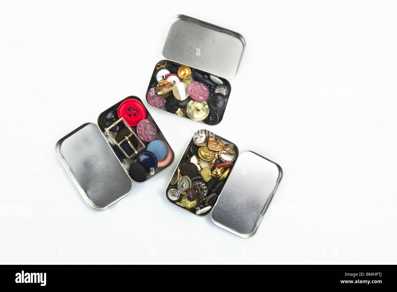 three clothing buttons metal boxes collection pattern Stock Photo - Alamy