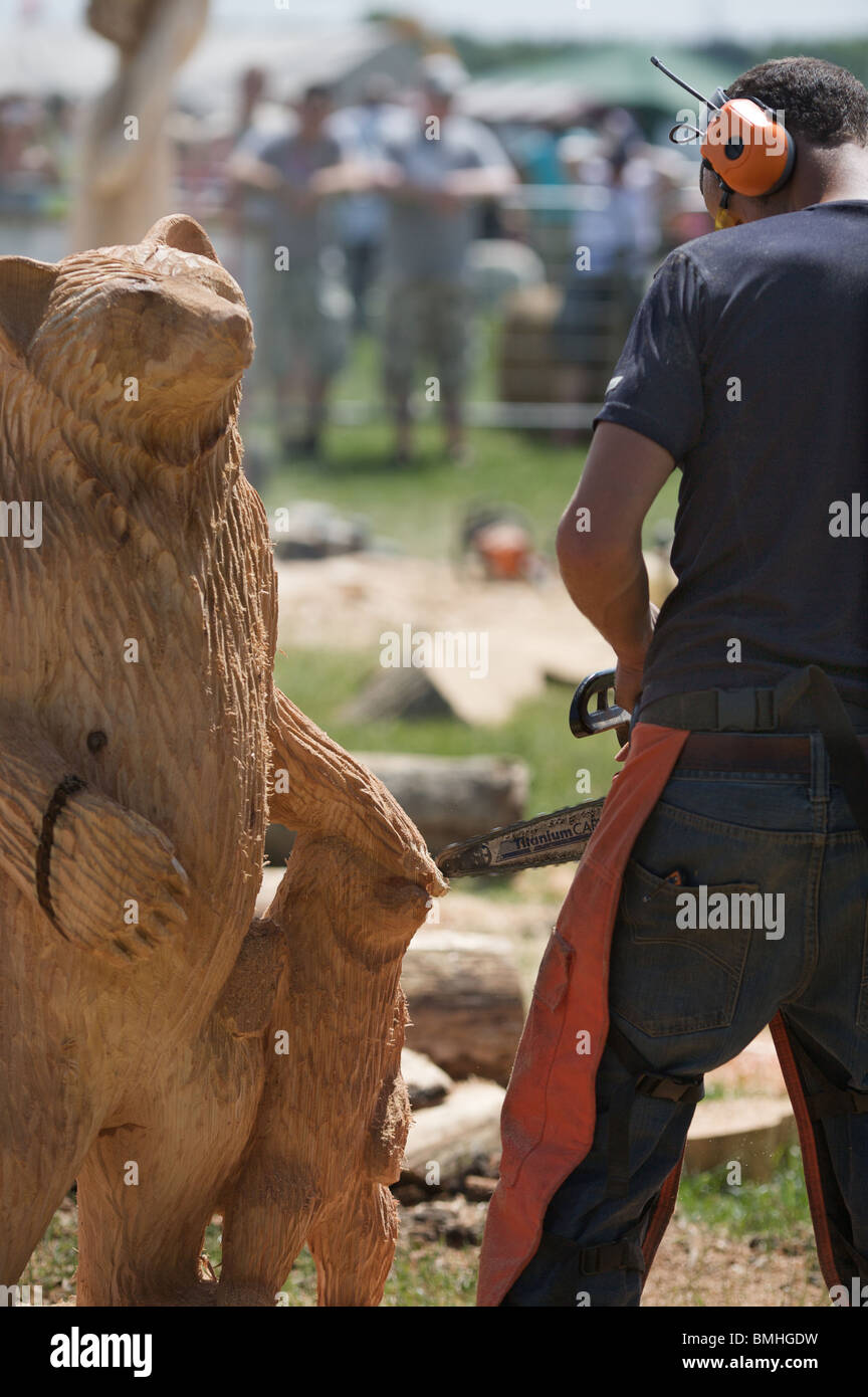 A competitor in the wood carving competition, Woodfest Wales, St Asaph ...