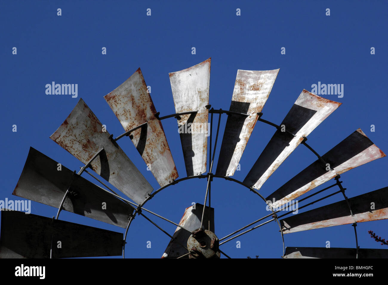SILVER WINDMILL AGAINST BLUE SKY BACKGROUND BDB Stock Photo - Alamy