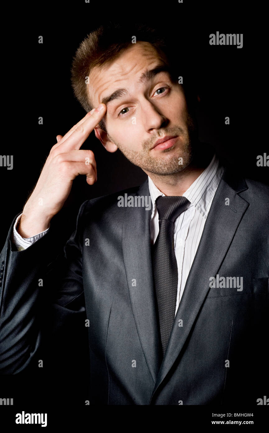 young confident businessman frowning eyebrows Stock Photo - Alamy