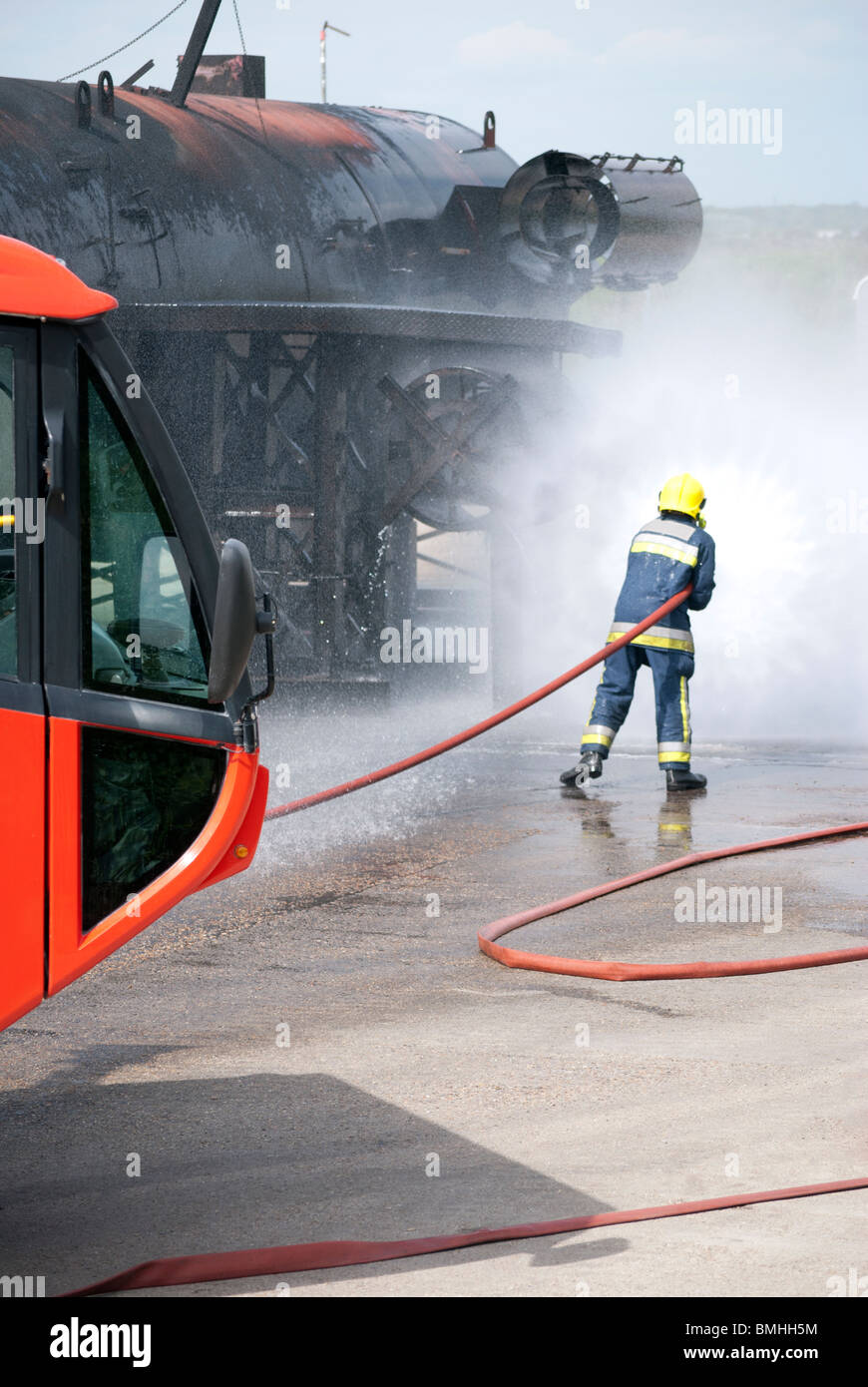 firefighter training with simulated aircraft fire Stock Photo - Alamy