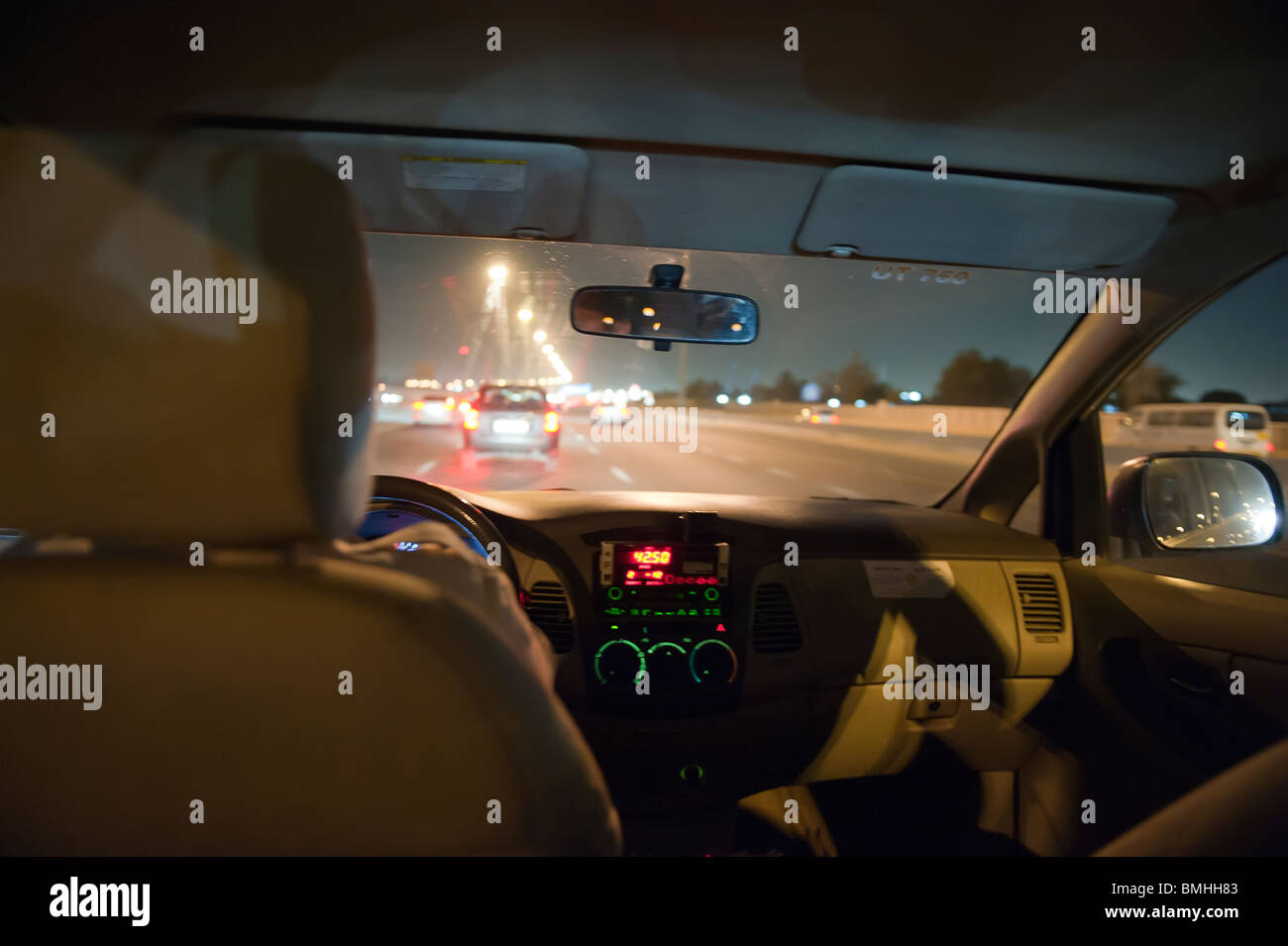 Taxi driver on Sharjah to Dubai Road, UAE Stock Photo - Alamy