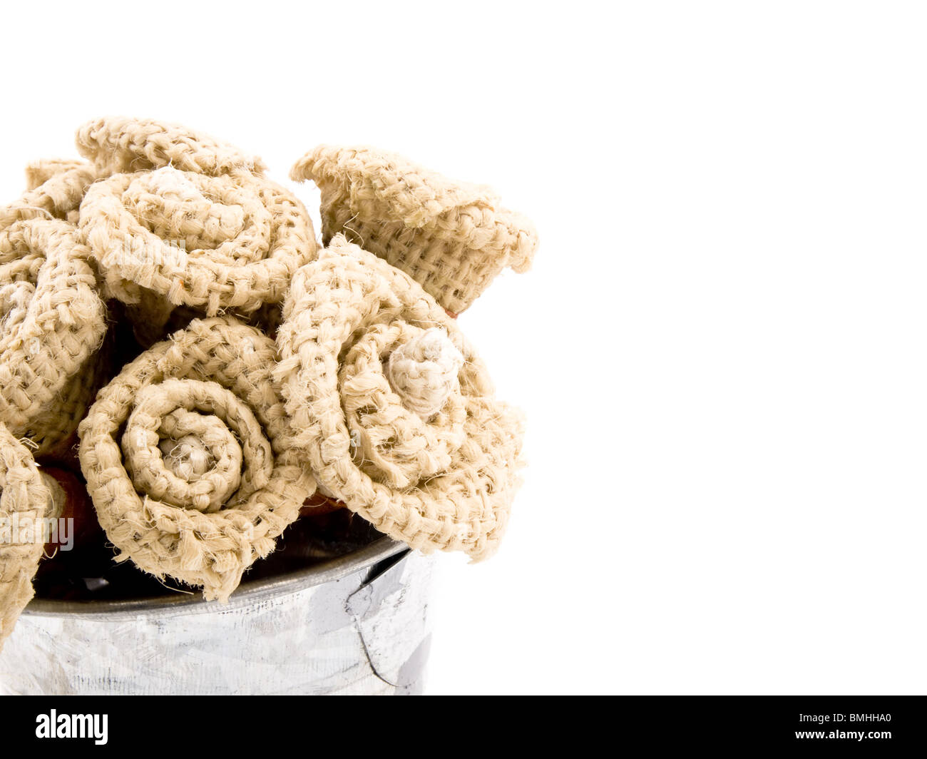 Closeup picture of handmade flowers in small metal bucket on white ...