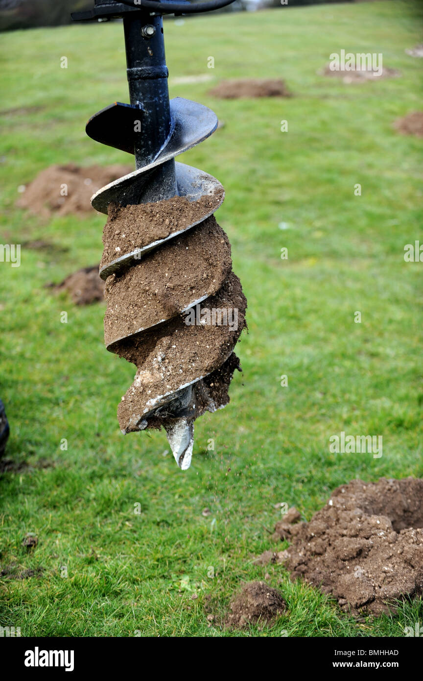 Big drill bit on the end of a power boxer digger Stock Photo - Alamy