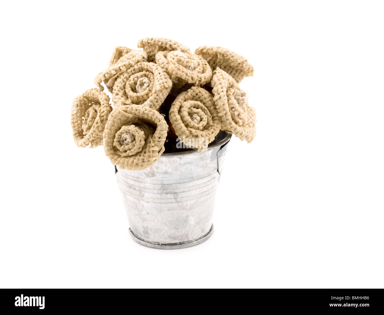 Handmade flowers in small bucket on white background Stock Photo - Alamy