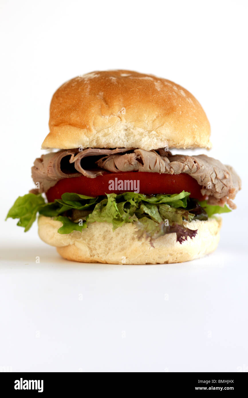 Fresh Cold Roast Beef And Salad Bread Roll Against A White Backgorund ...