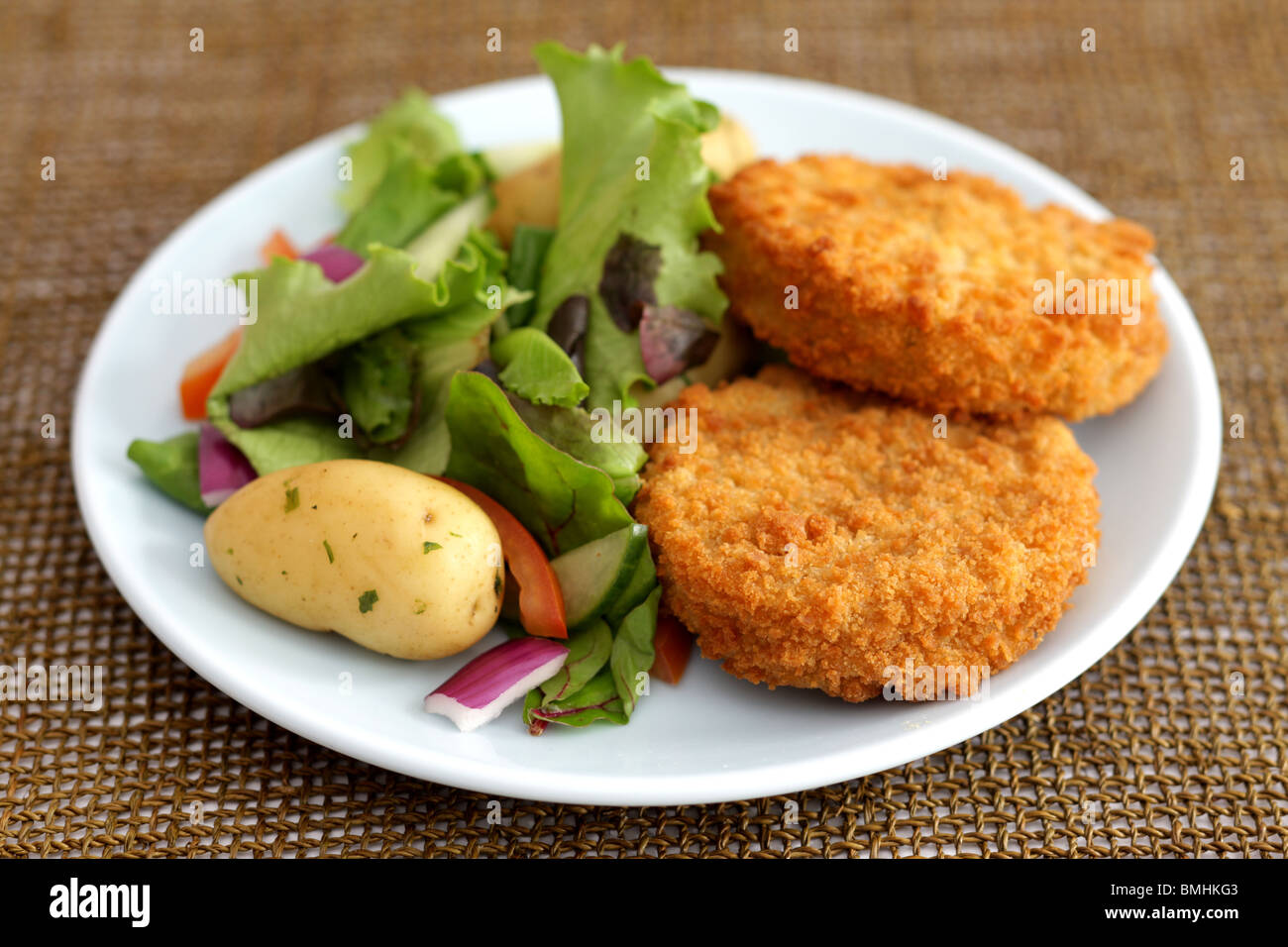 Freshly Prepared Cooked Breaded Haddock Fishcakes With A Healthy Fresh ...