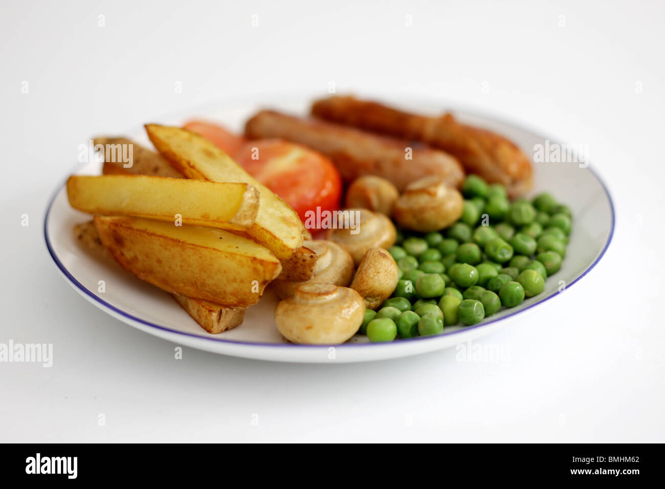 Sausage Chips and Peas Stock Photo - Alamy