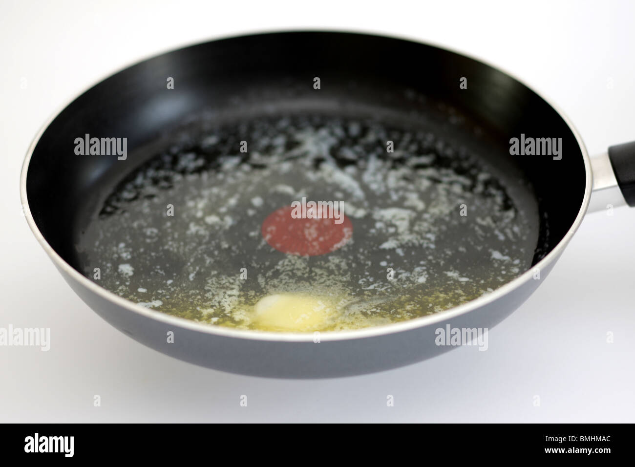 Heated frying pan hi-res stock photography and images - Alamy