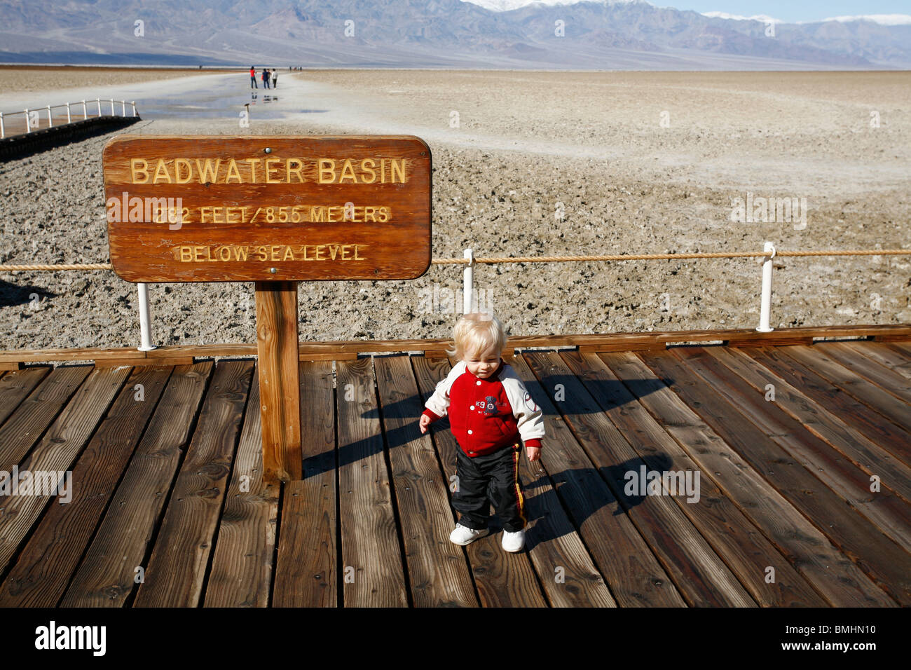 15 month old boy standing in front of the Badwater Basin sign at Death ...