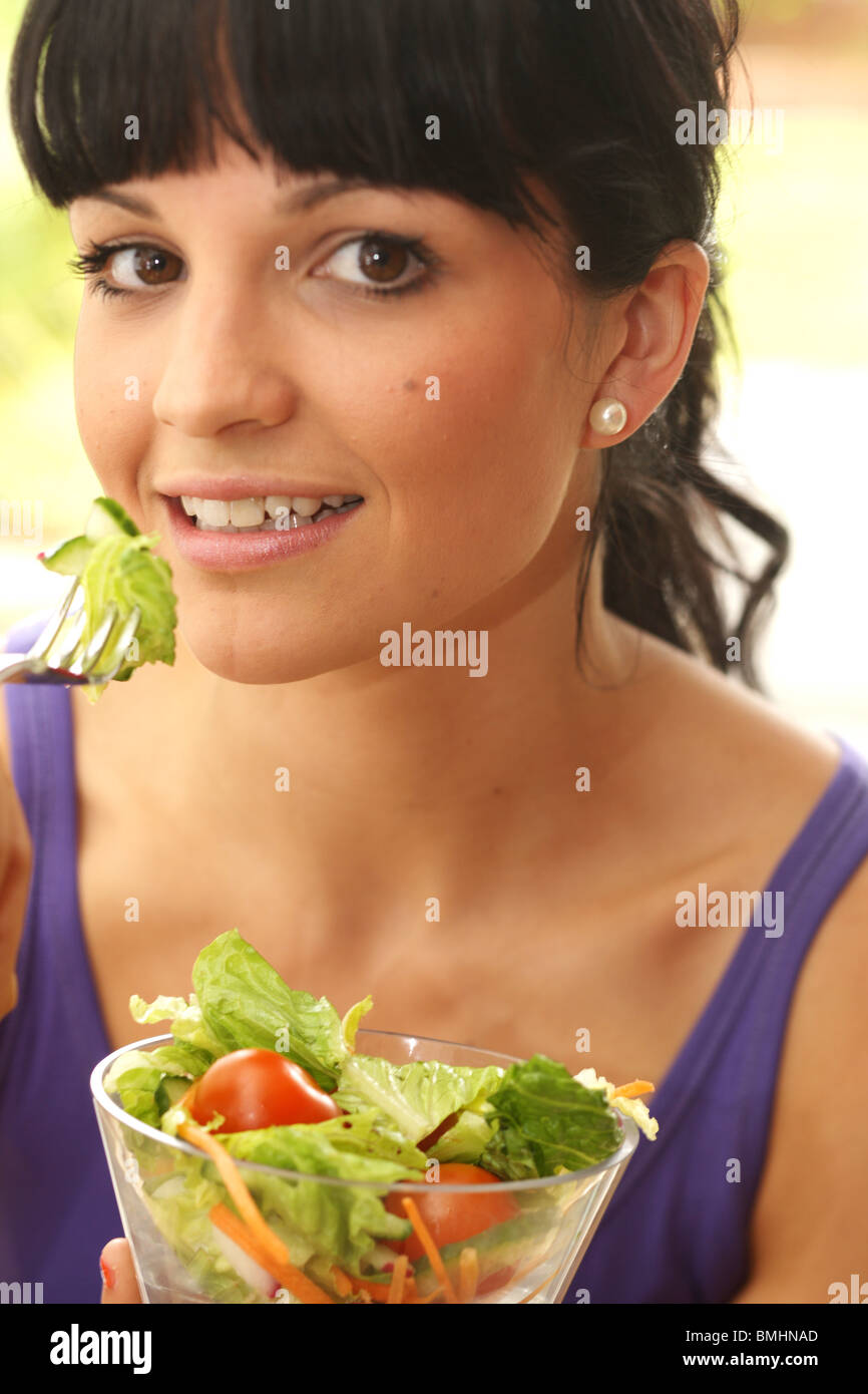 Young Woman Eating Salad. Model Released Stock Photo - Alamy