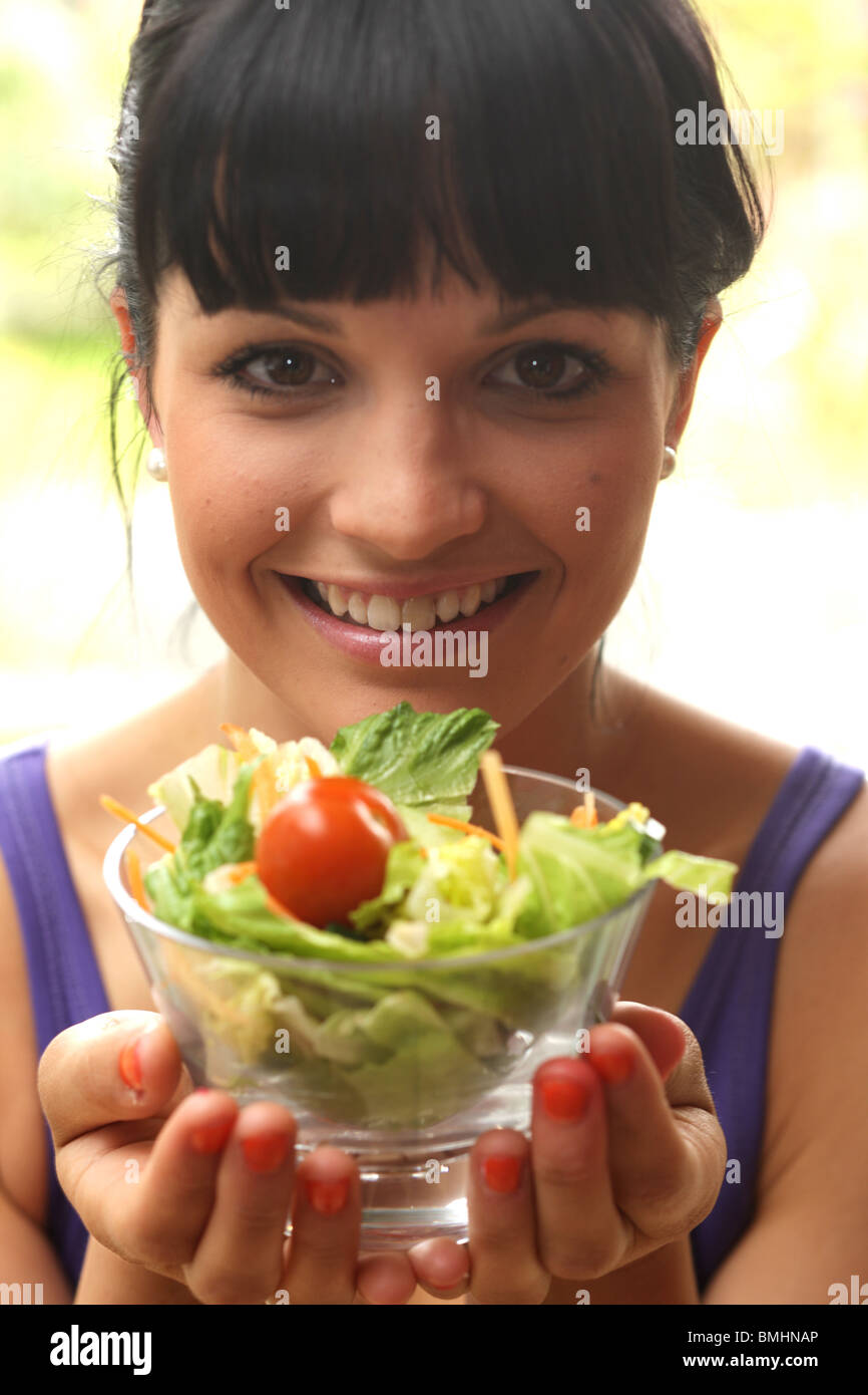 Young Woman Eating Salad. Model Released Stock Photo - Alamy