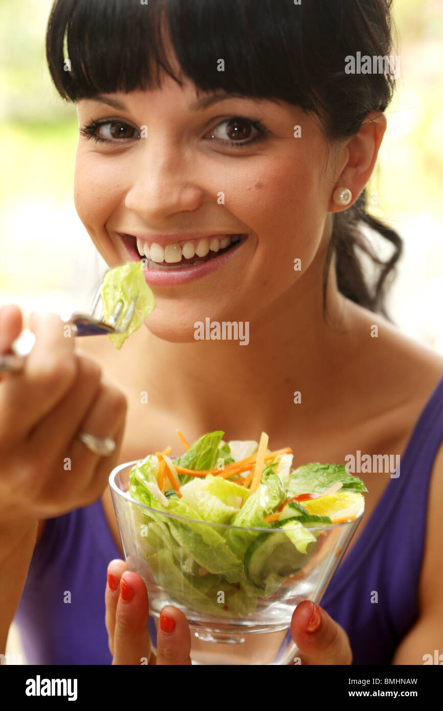 Young Woman Eating Salad. Model Released Stock Photo - Alamy
