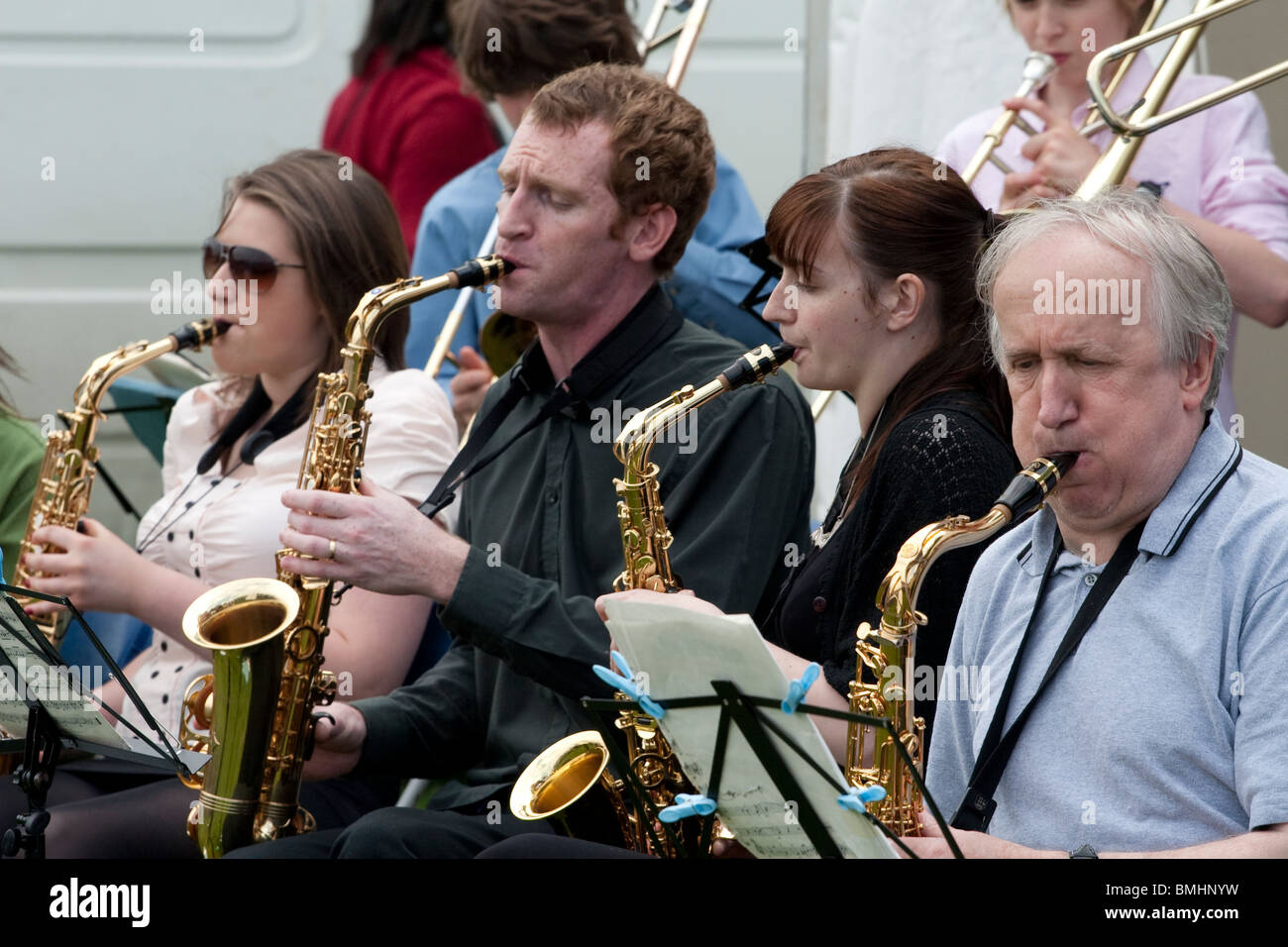 A mixture of school children and teachers performing at a fair Stock ...