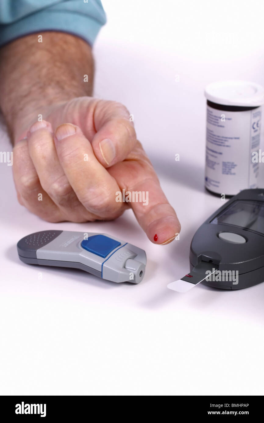 Blood glucose monitor finger hi-res stock photography and images - Alamy