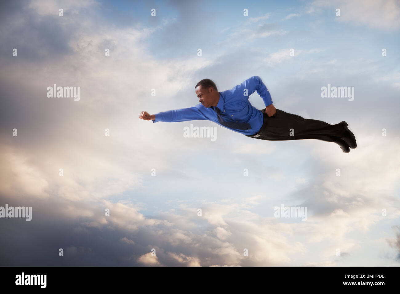 Businessman flying in the sky Stock Photo - Alamy