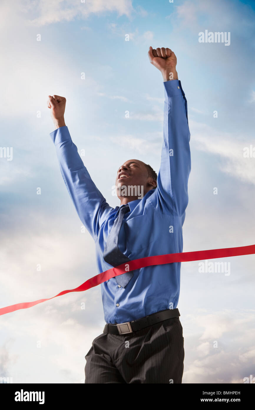 Businessman winning a race Stock Photo - Alamy