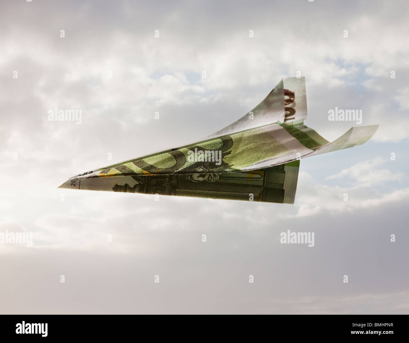 Paper airplane made out of money Stock Photo - Alamy