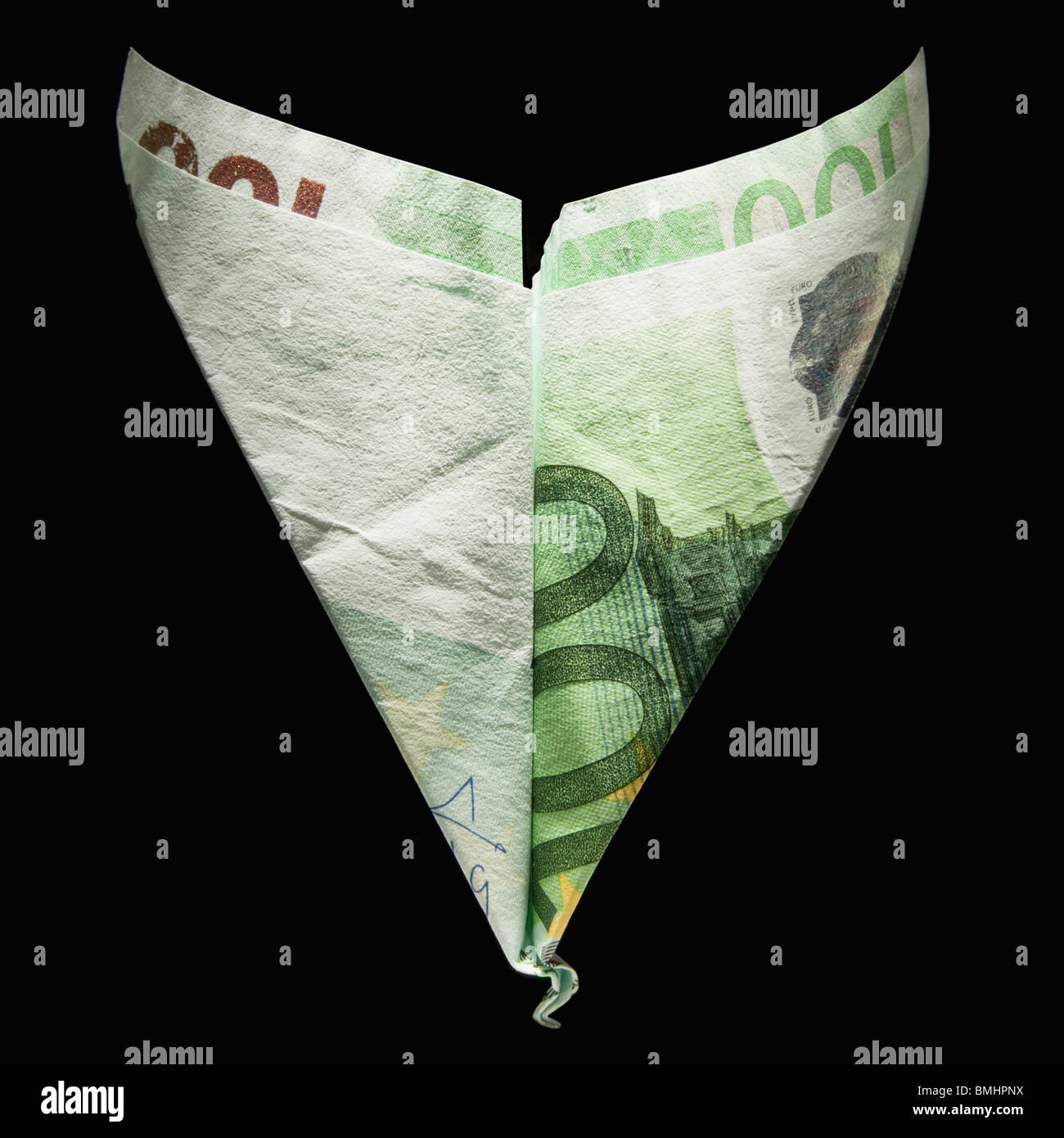 Paper airplane made out of money Stock Photo - Alamy