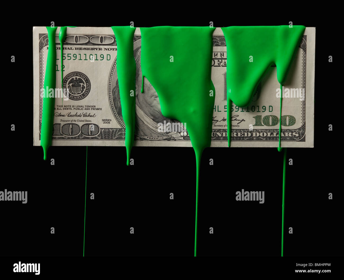 American currency covered in green paint Stock Photo - Alamy
