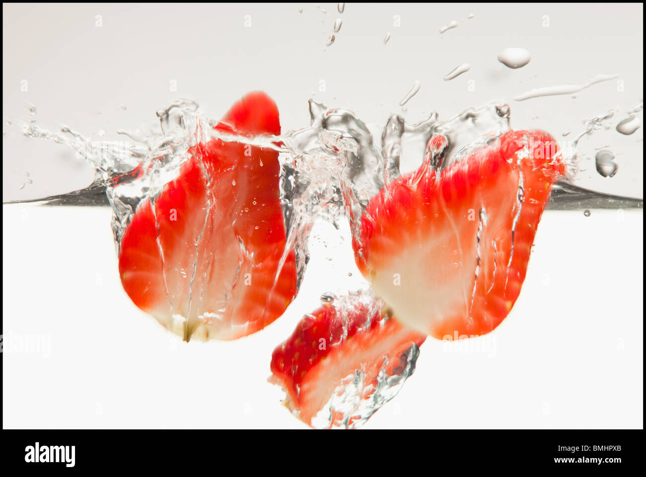 Strawberries in water Stock Photo - Alamy