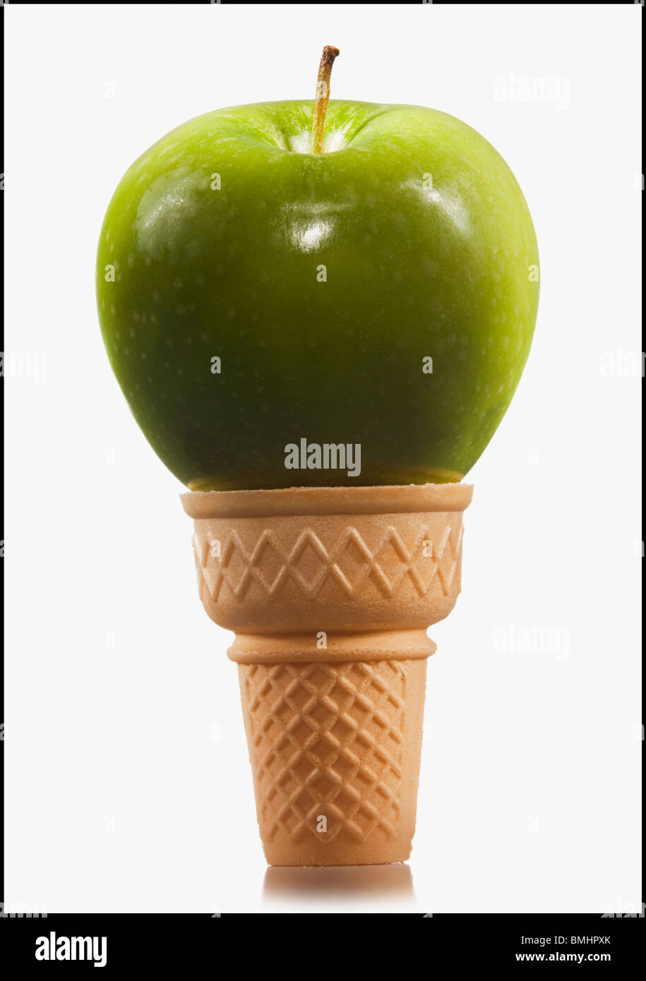 Green apple in an ice cream cone Stock Photo - Alamy