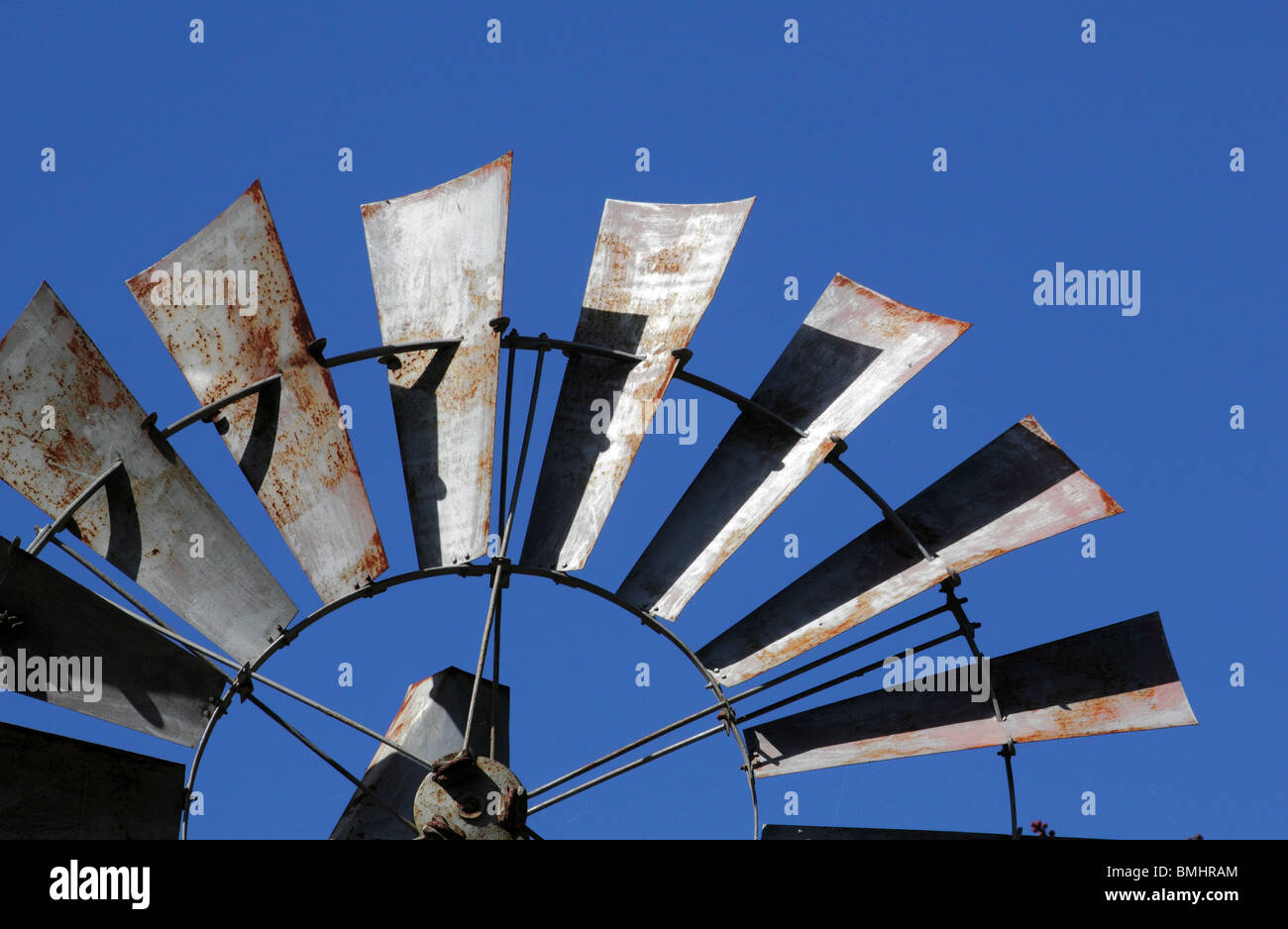 SILVER WINDMILL AGAINST BLUE SKY BACKGROUND BDB Stock Photo - Alamy