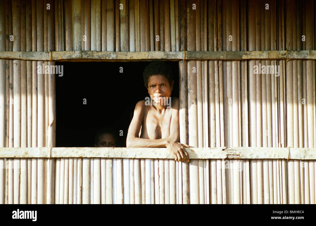 Papuan woman in a resettlement camp, West Papua. Indonesia Stock Photo ...