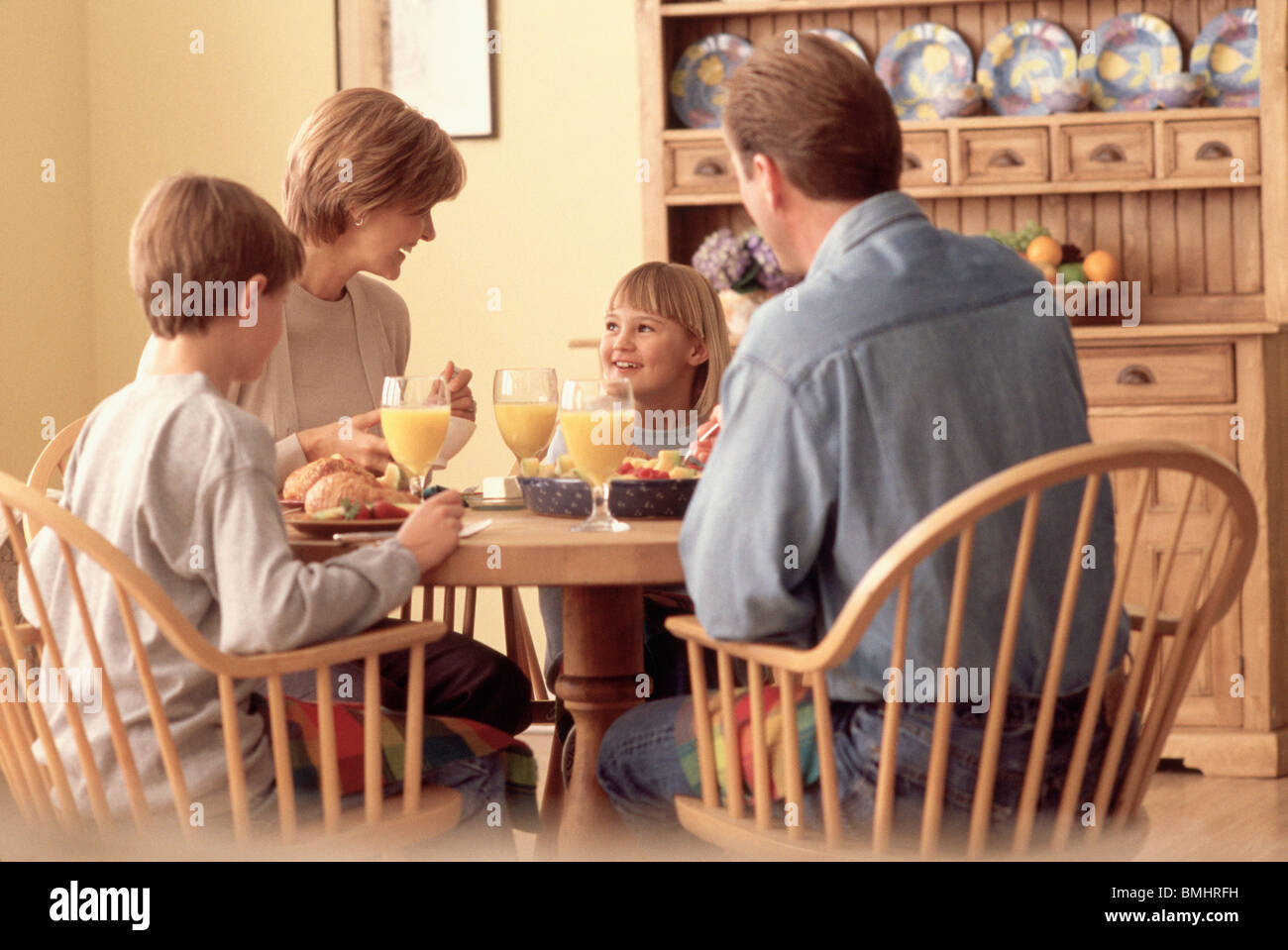 Family eating breakfast together Stock Photo - Alamy