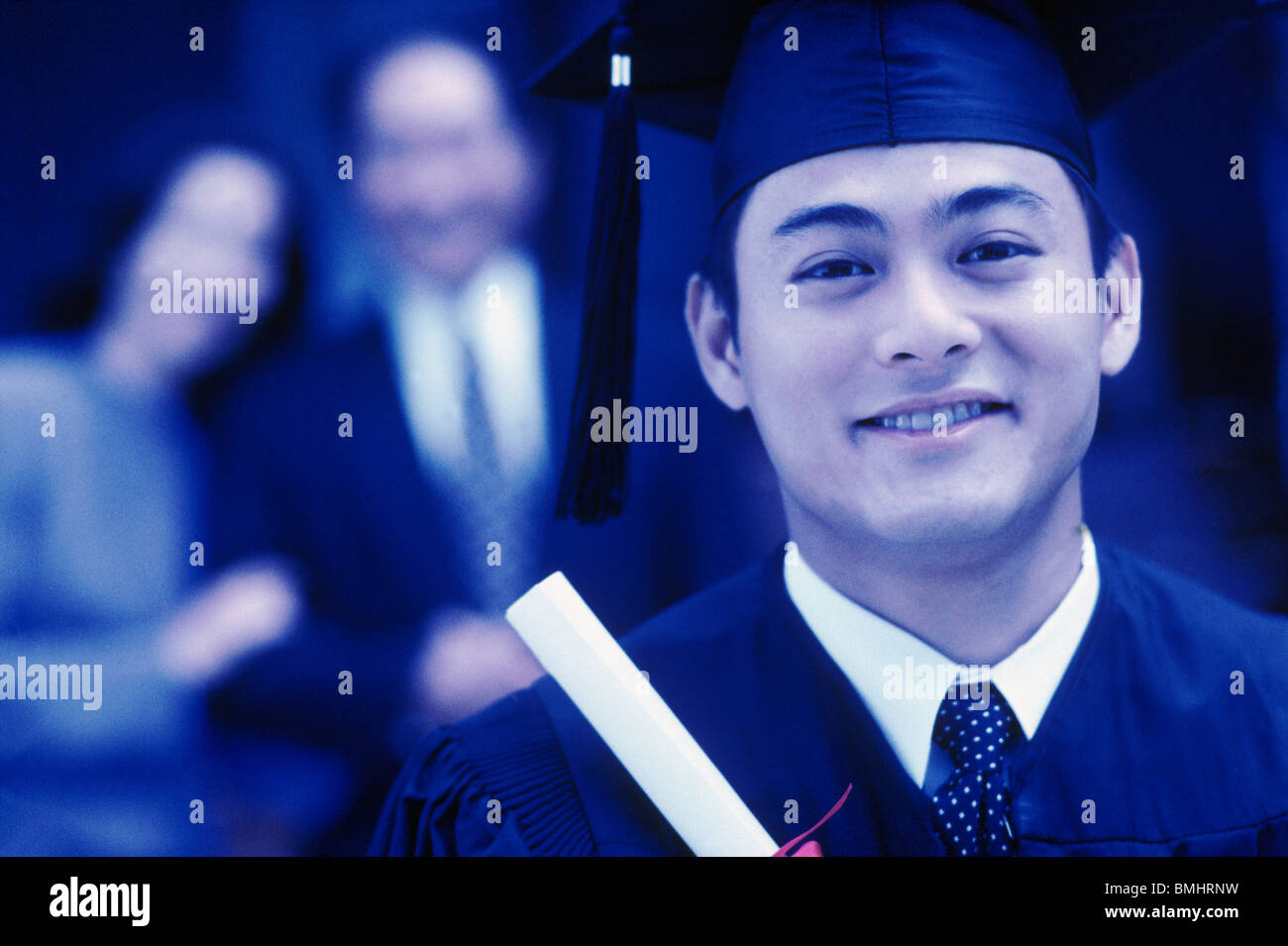 Graduate holding his diploma Stock Photo - Alamy