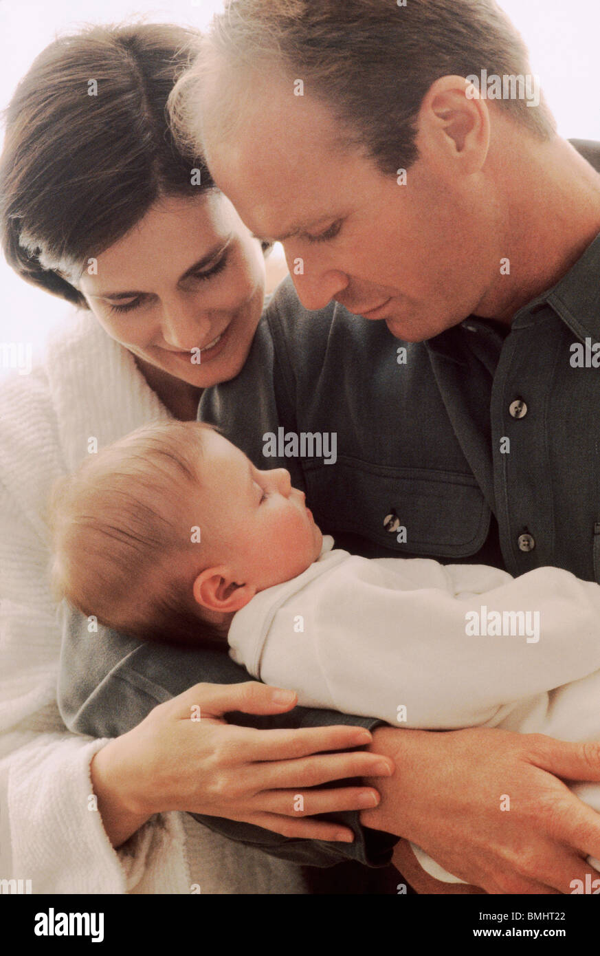 Mother and father admiring their newborn baby Stock Photo - Alamy