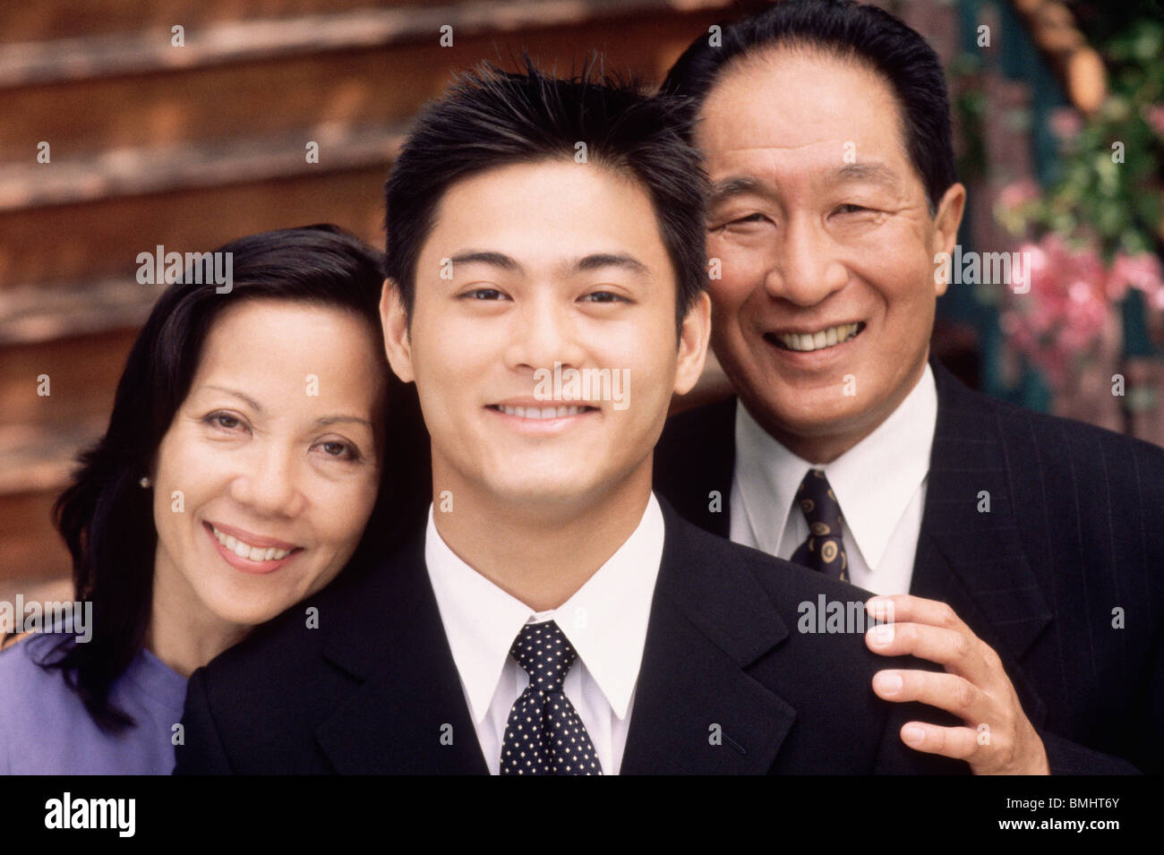 Portrait of a young man with his parents Stock Photo - Alamy