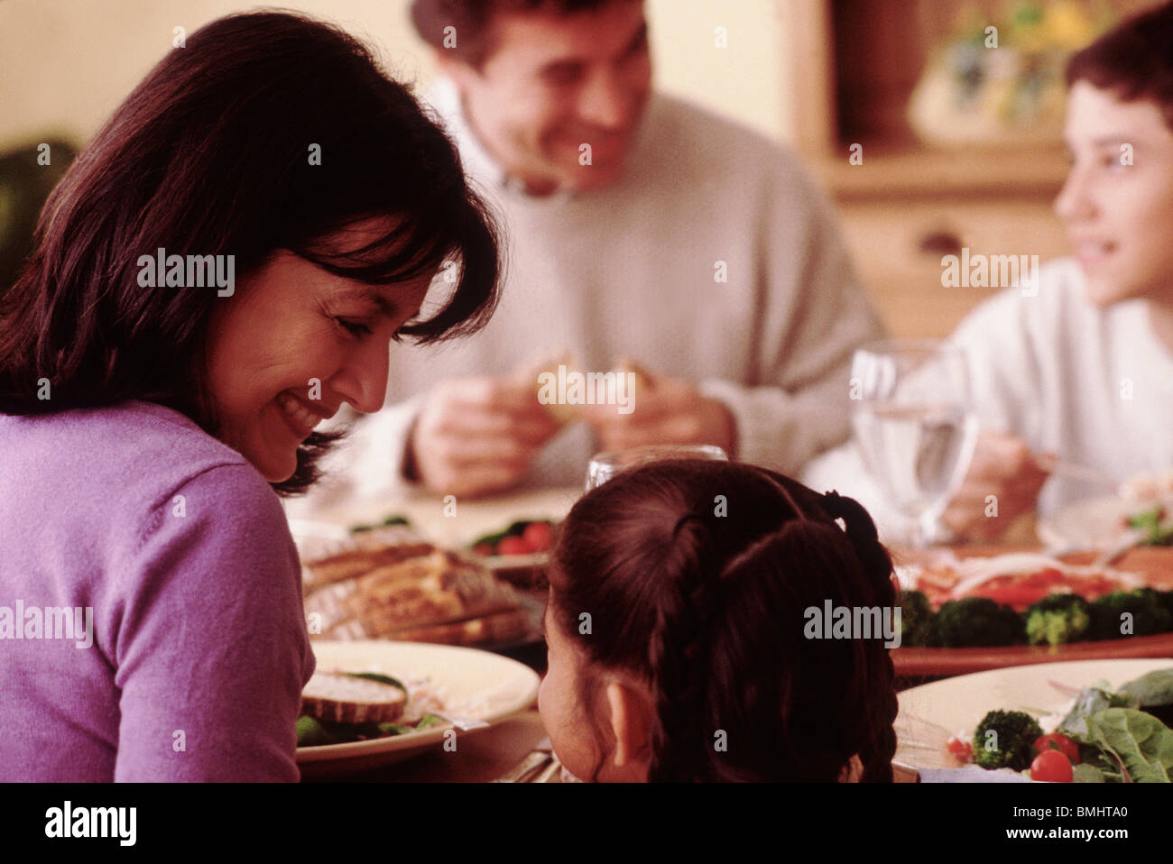 Family eating dinner at home Stock Photo - Alamy