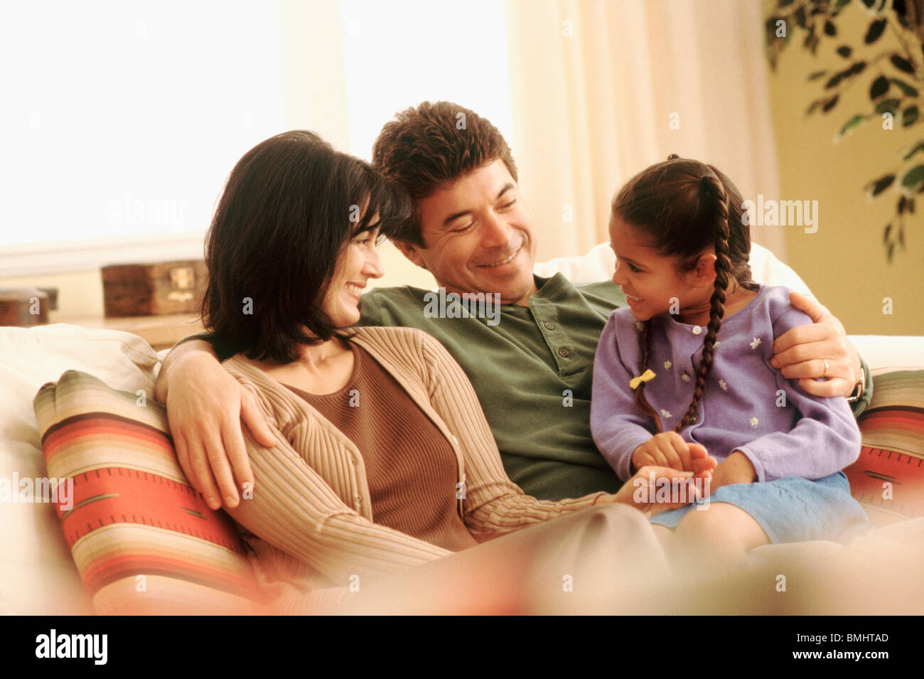Family relaxing at home Stock Photo - Alamy